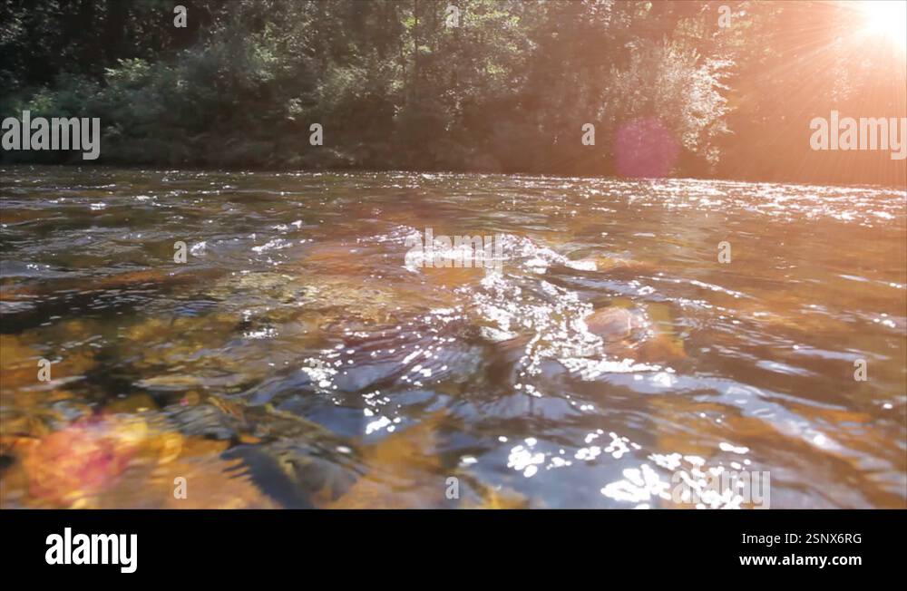 Rippling water and currents of a flowing river in HD Stock Video Footage - Alamy