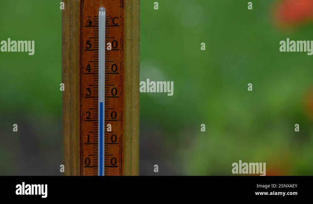 Fast rising temperature on wooden outdoor thermometer scale Stock Video ...