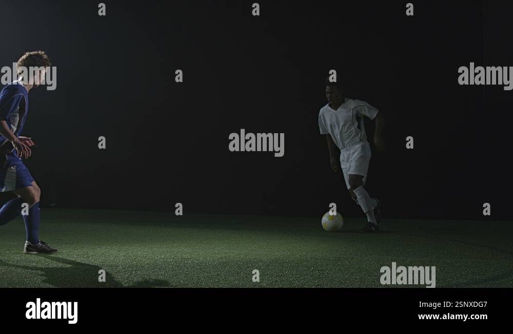 Two soccer players face off and try to outdo each other Stock Video ...