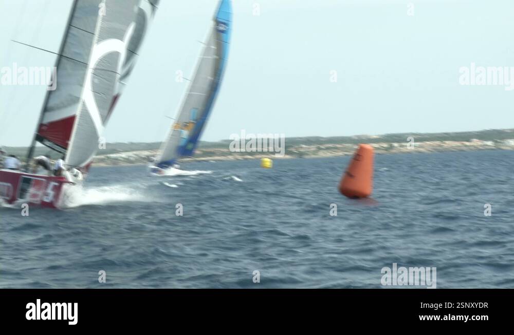 Crew of sailing boat maneuvering during regatta Stock Video Footage - Alamy