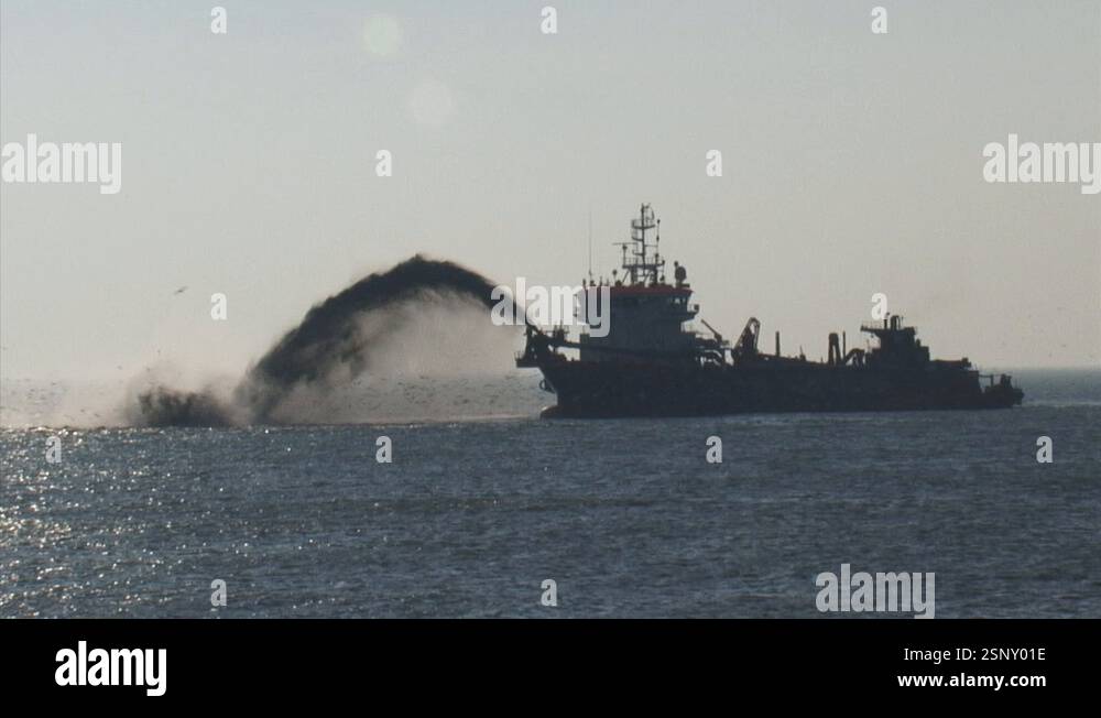 Trailing suction hopper dredgers rainbowing at North Sea coast Stock ...