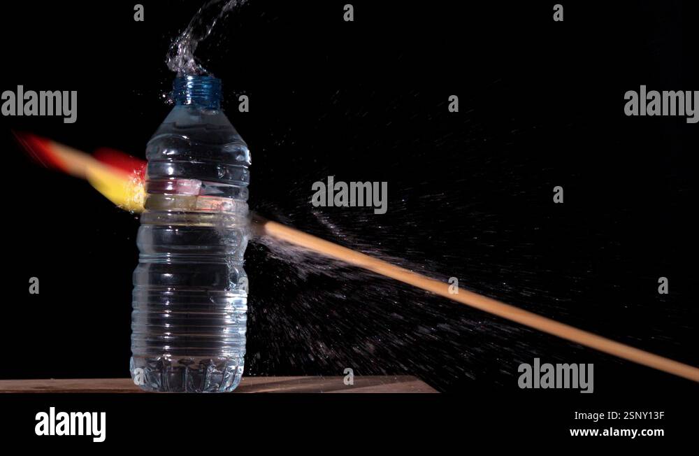 Arrow shooting through plastic bottle Stock Video Footage - Alamy