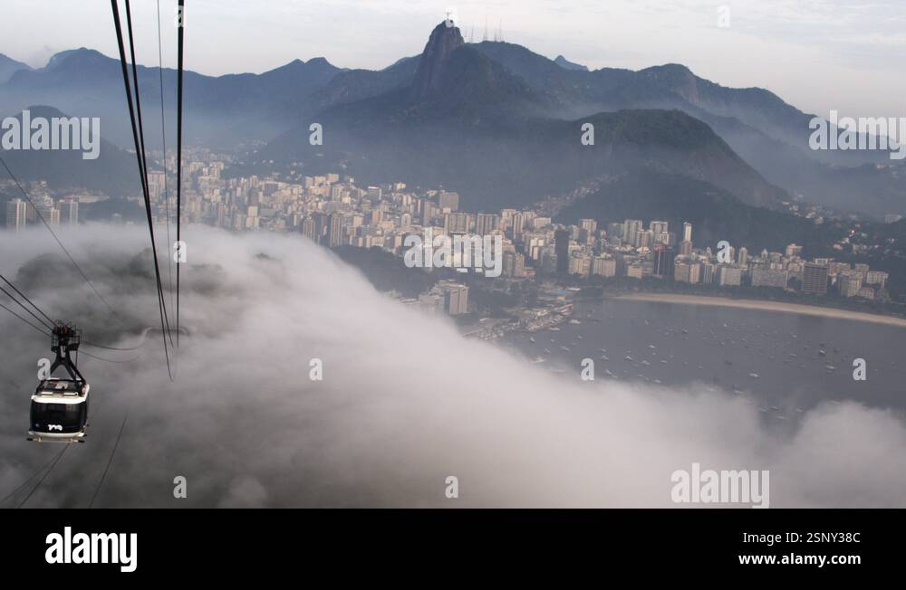 Gondola ride down the mountain on a misty day in Rio de Janeiro, Brazil ...