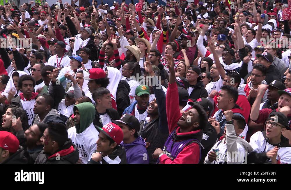 Toronto sports fans watch game outside during playoffs Stock Video ...