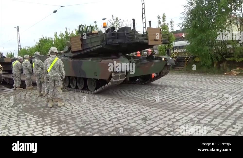 us army soldiers guide tank off of rail transport Stock Video Footage ...