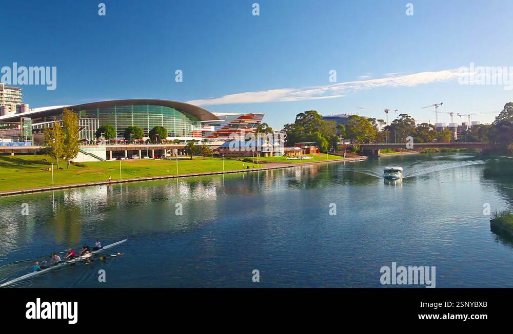 Tour boat and canoe cruising along River Torrens in Adelaide, Australia ...
