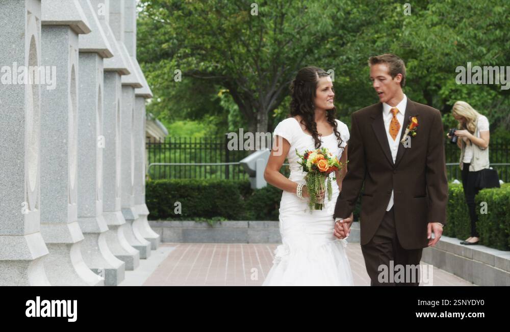 MS DS Bride and groom walking and kissing in garden / Salt Lake City ...