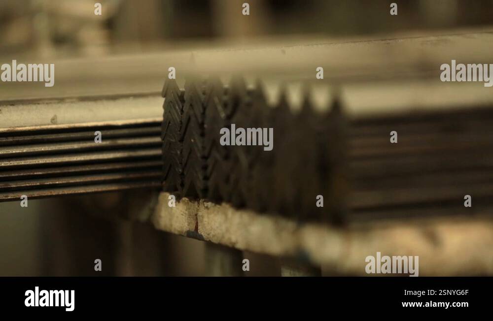 Man working cutting iron circular disk machine, making sparks ...