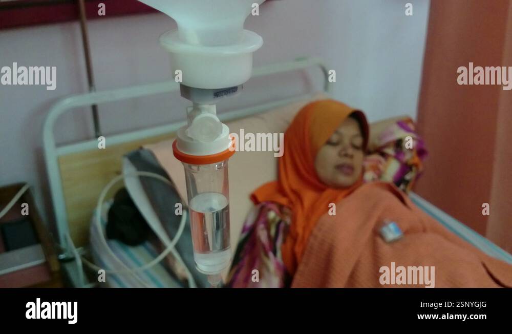 Hospital scene - Women patient in pain on Intravenous therapy. Face out ...