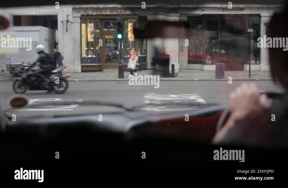 London Taxi Mayfair drive by Stock Video Footage - Alamy