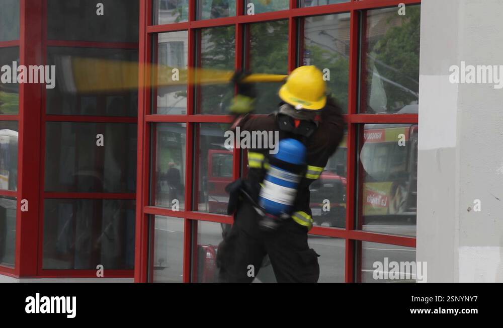 Fireman swinging pike pole and breaks windows Stock Video Footage - Alamy