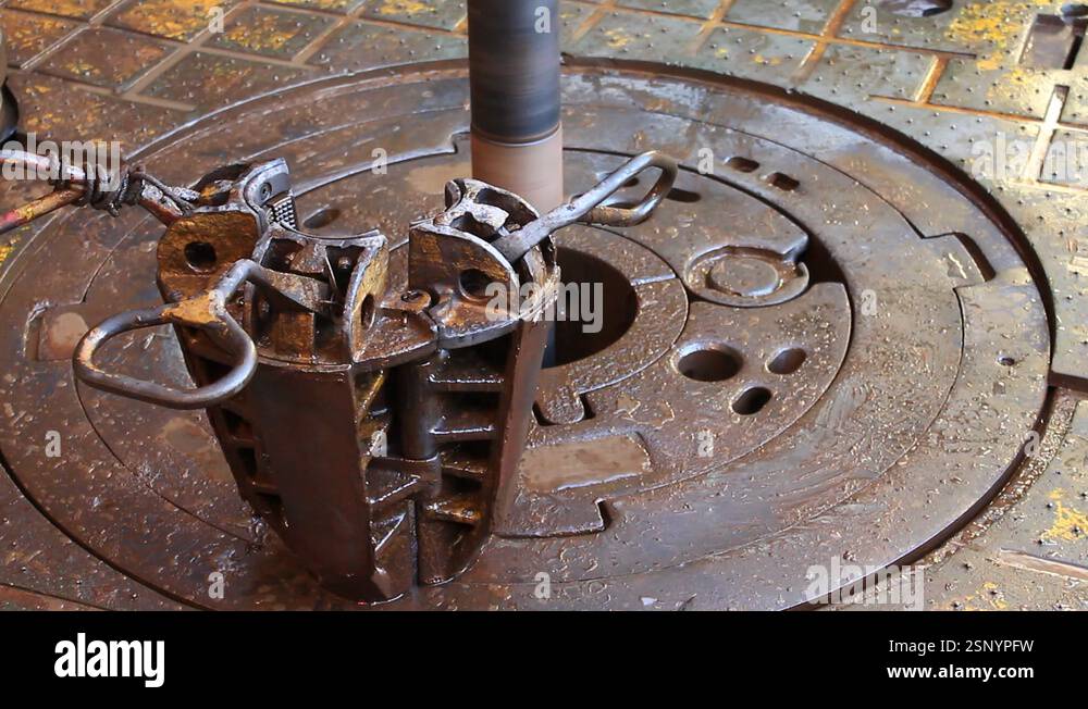 Slip on the rotary table while drilling oil well and pipe being rotated ...