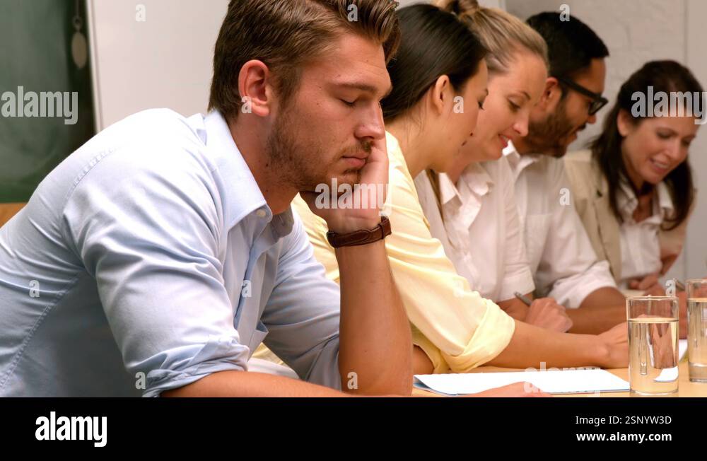 Casual businessman falling asleep during meeting Stock Video Footage ...