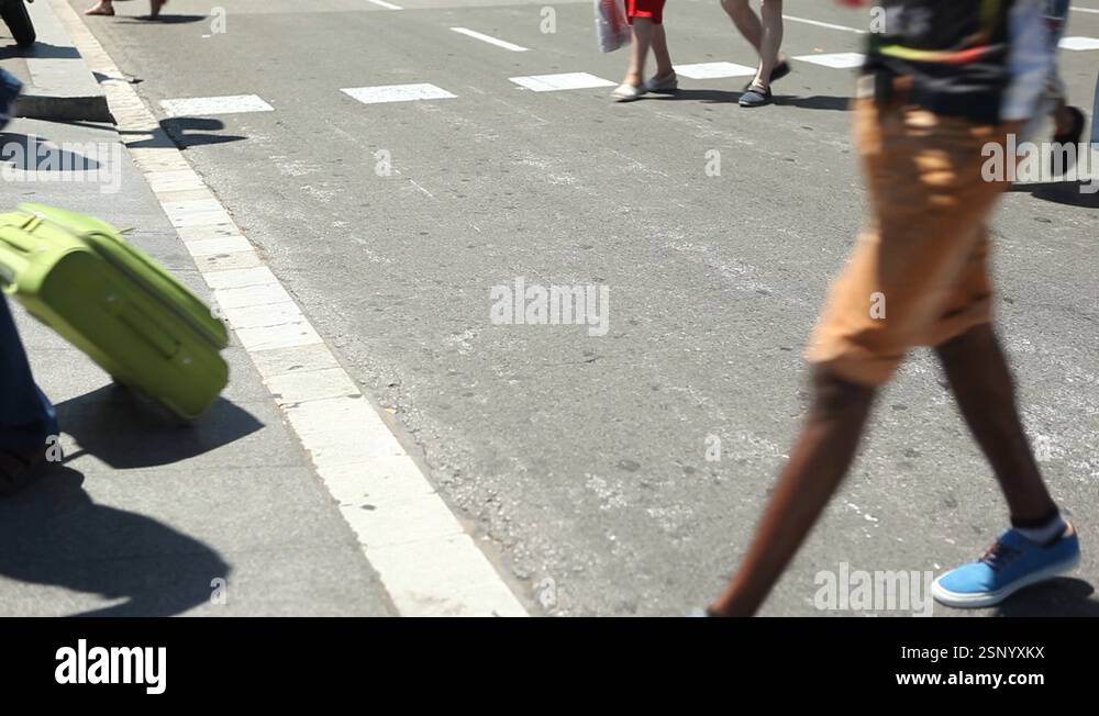Slow Motion crowd of People walking at busy city street intersection ...