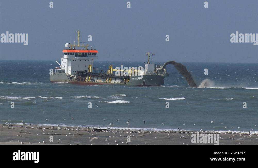 trailing suction hopper dredger rainbowing, dumping sand slurry at ...