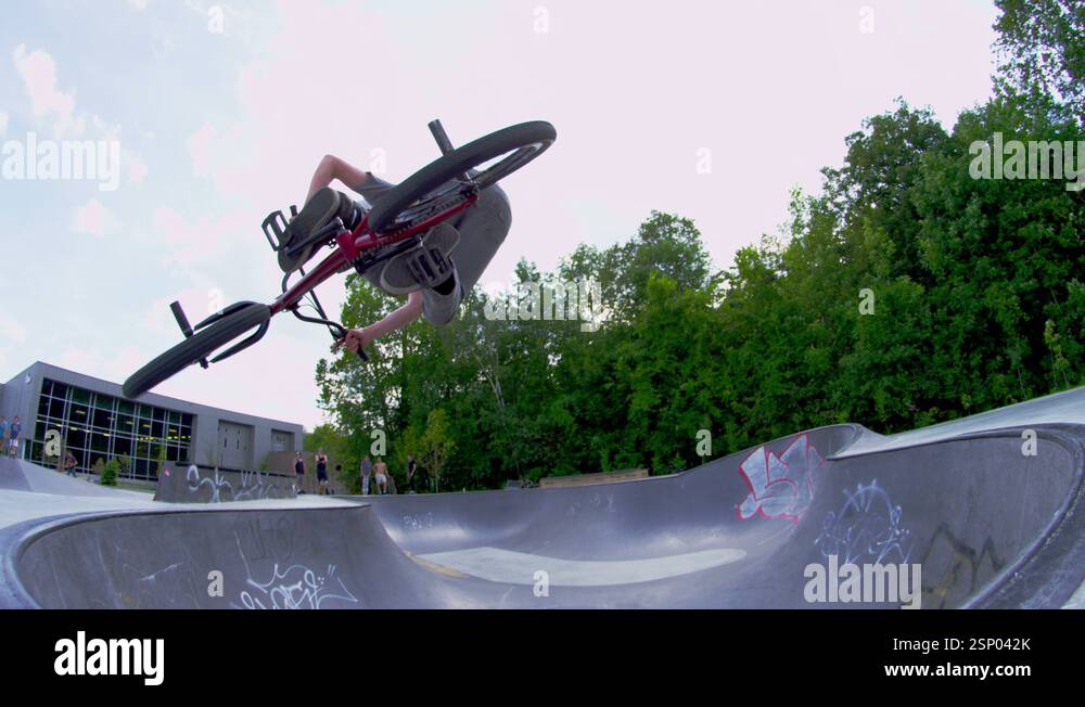 BMXer does big air trick on a skatepark ramp Stock Video Footage - Alamy