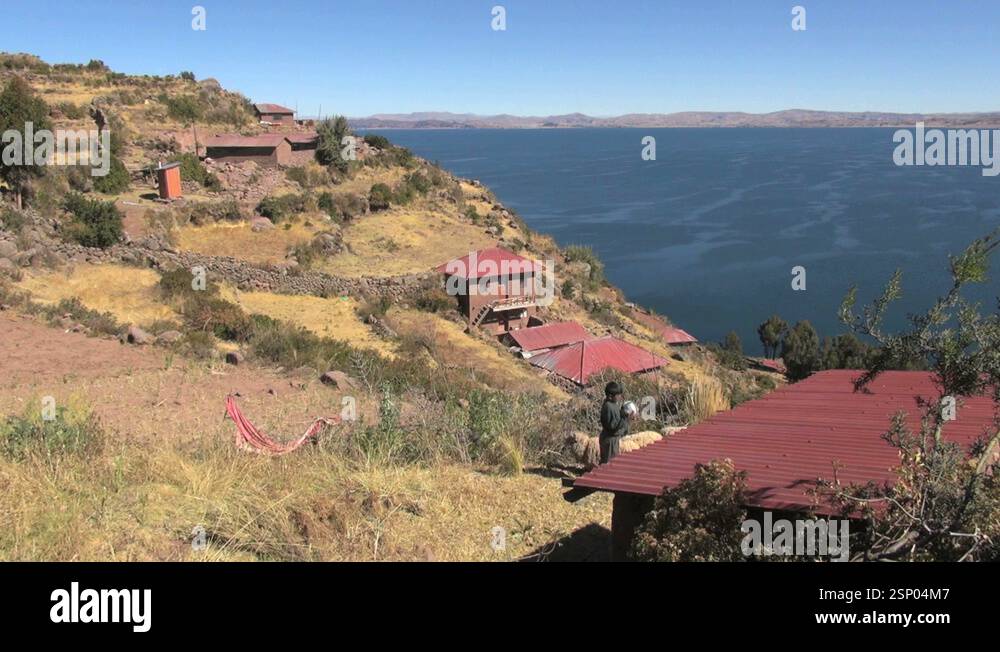 Peru Taquile lake overlook red roof houses and terraces 7 Stock Video ...