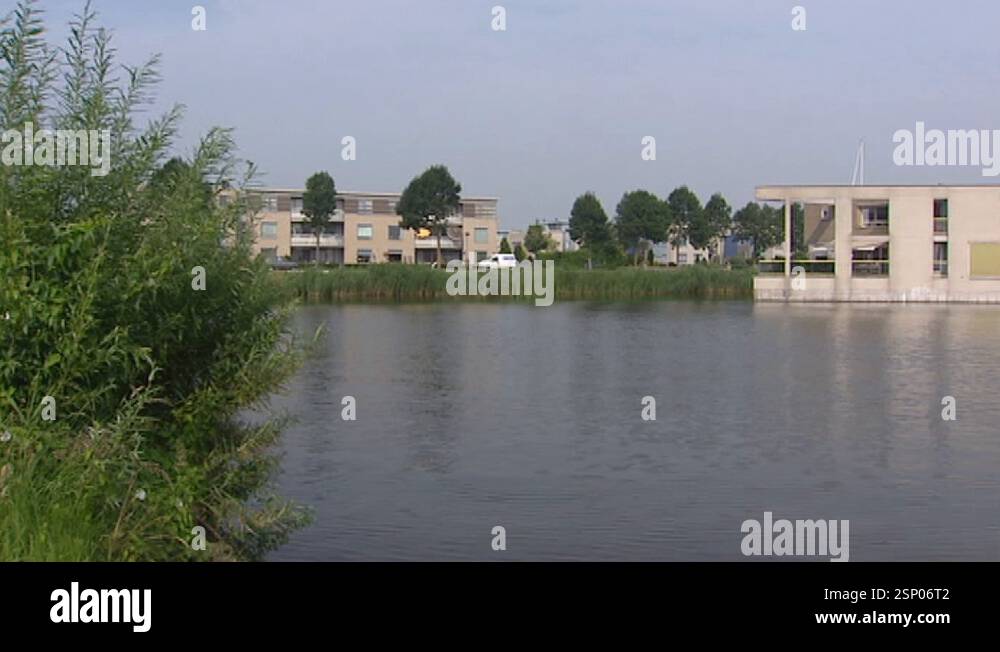 ZEEWOLDE, THE NETHERLANDS pan skyline village waterfront Stock Video ...