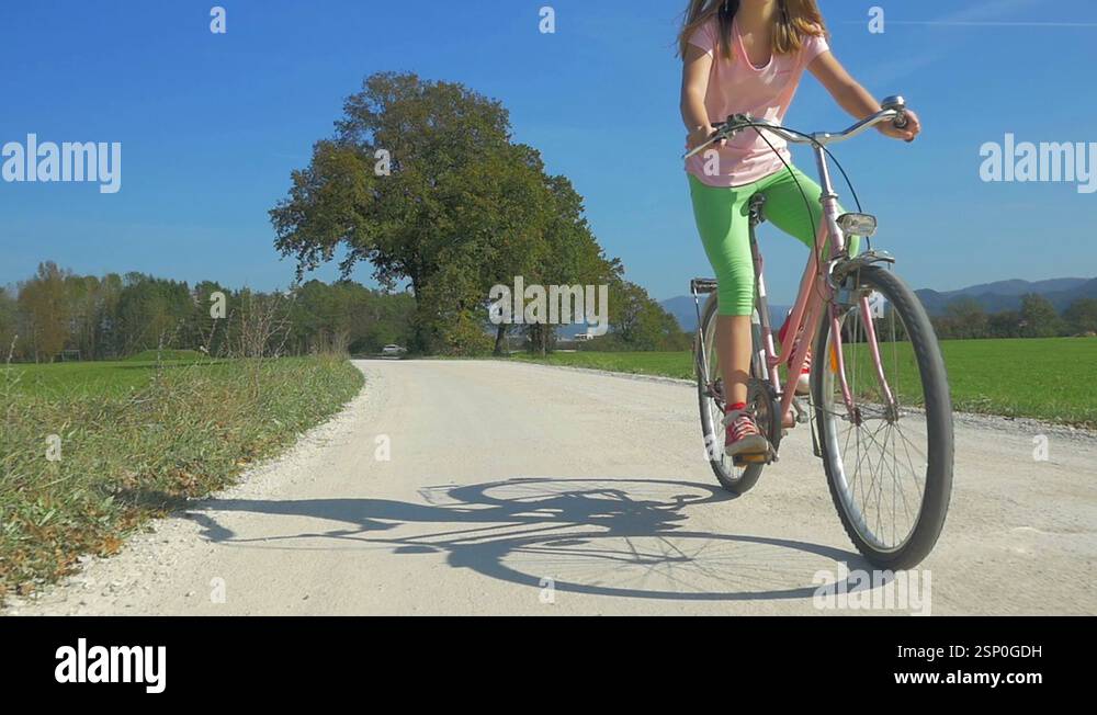 HD Slow-Mo: Teenage Girl Overtaking on her Bike Stock Video Footage - Alamy