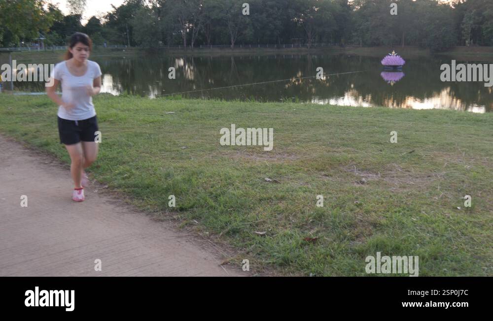 Cute Asian Girl prepare to jogging in the park Stock Video Footage - Alamy