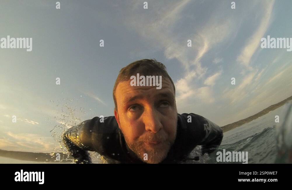 Duck diving a big wave. HD Slow Motion Stock Video Footage - Alamy