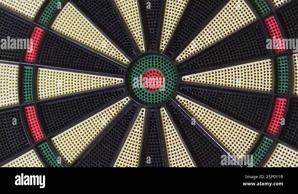 Throwing darts on game board Stock Video Footage - Alamy