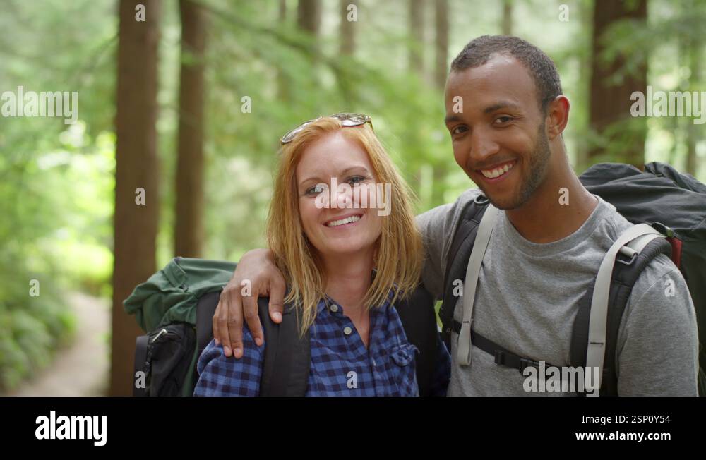 Hiking couple smile into camera Stock Video Footage - Alamy