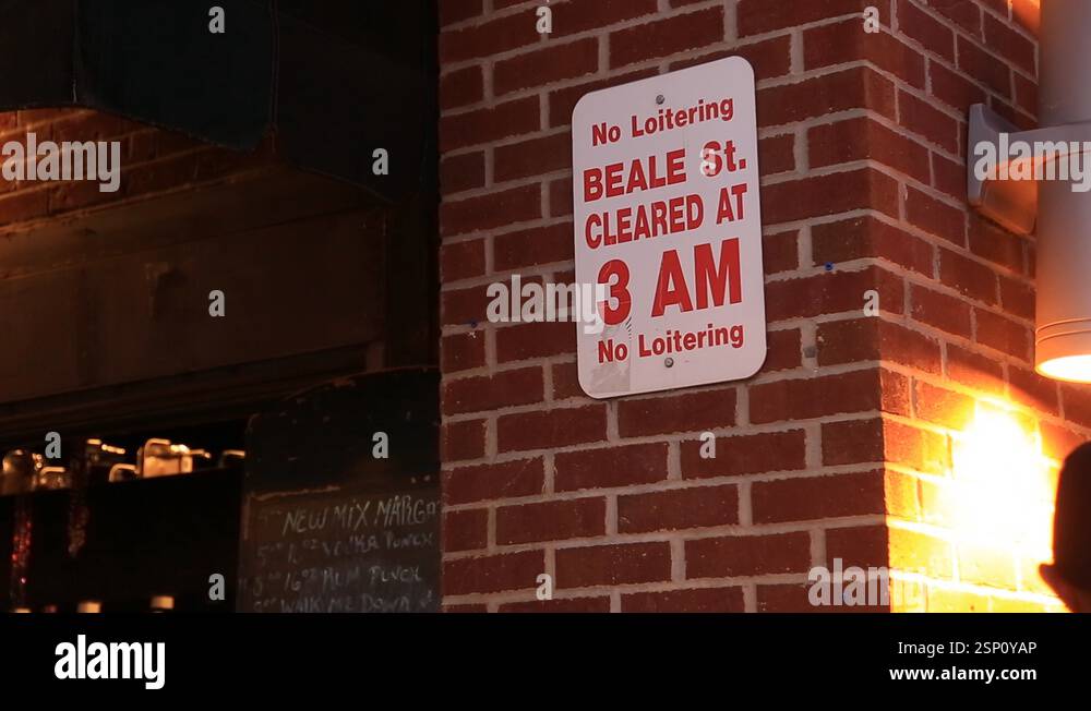 Zoom out from No Loitering Sign to Pedestrians on Beale, Memphis Stock ...