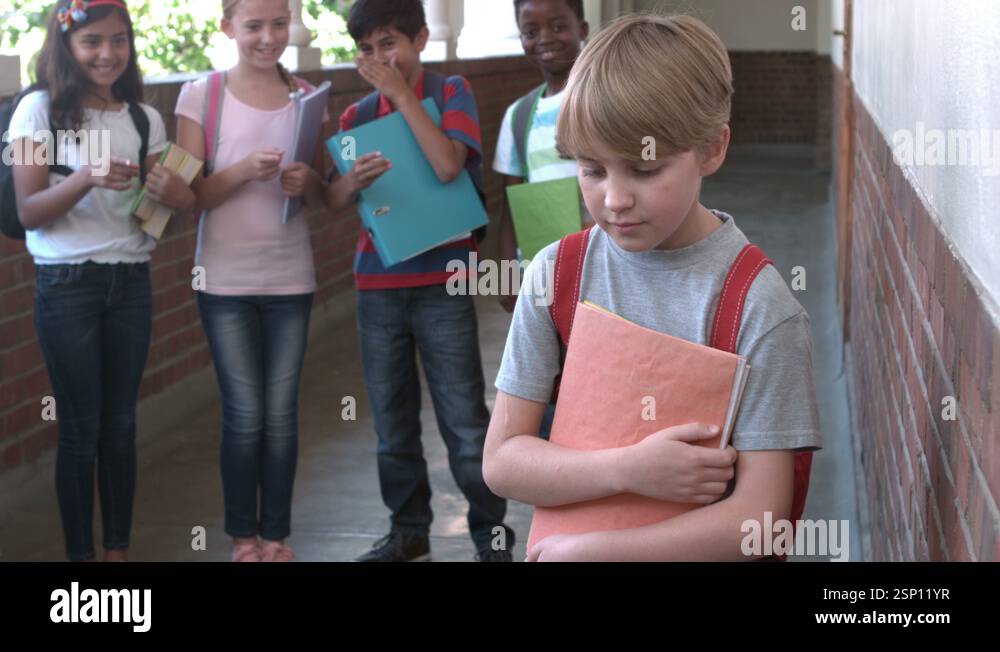 Pupils bullying another in the hall Stock Video Footage - Alamy