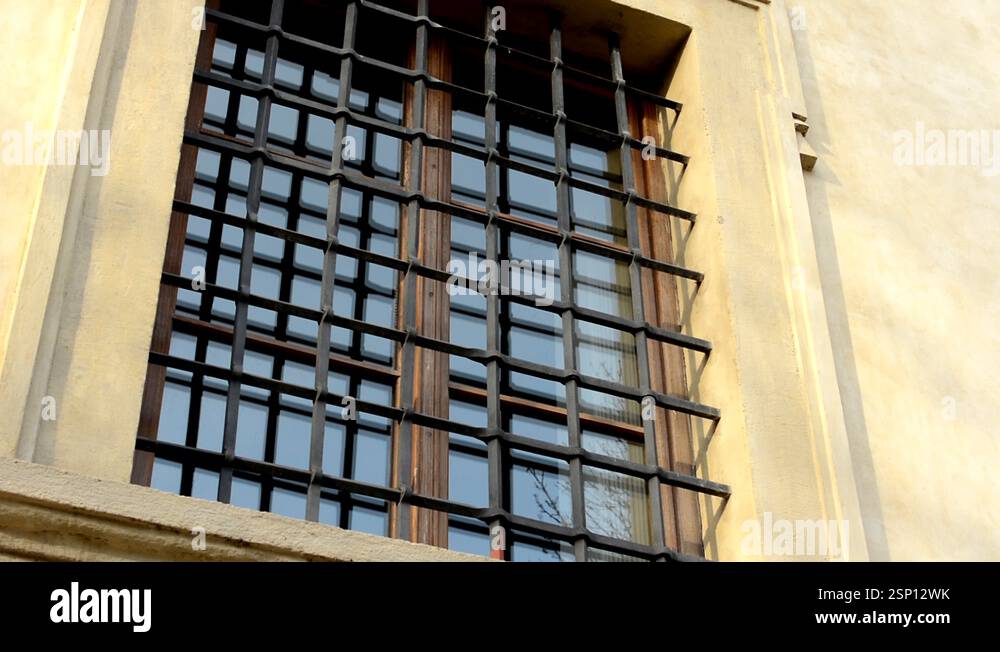 barred window - building Stock Video Footage - Alamy