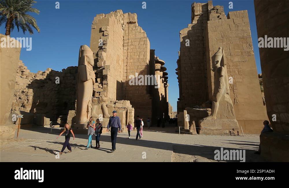 TOURSITS AT COLOSSUS RAMSES II, TEMPLE AMUN, KARNAK, EGYPT Stock Video ...