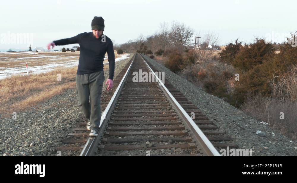 3014 Man Jumping from Train Track to Train Track, 4K Stock Video ...