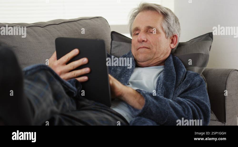 Elderly man falls asleep with tablet Stock Video Footage - Alamy