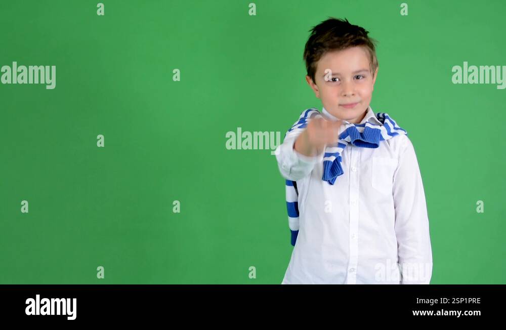 young handsome child boy points to camera - green screen - studio Stock ...