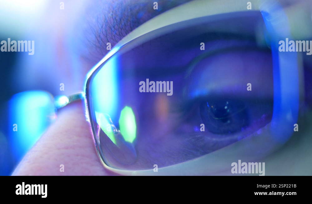 Reflection in the eye and glasses of the monitor when watching a movie ...