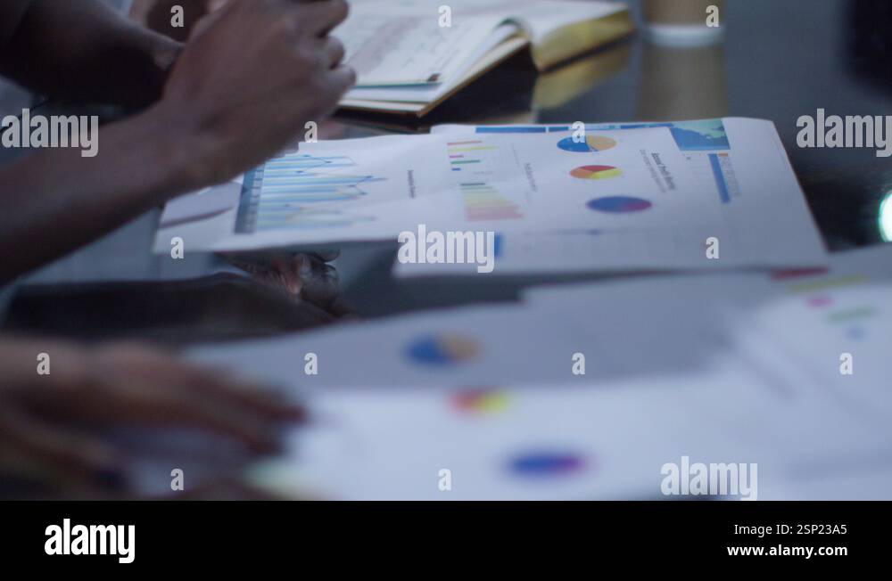4K Business group in a meeting looking over the company figures Stock ...