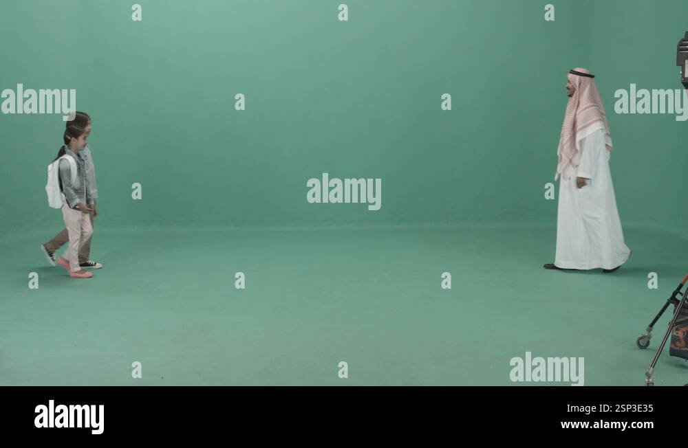 Arabic Adult Male with two Children walking Stock Video Footage - Alamy
