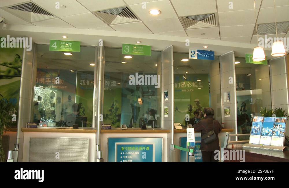 Chinese bank, customer at bank window, China Stock Video Footage - Alamy