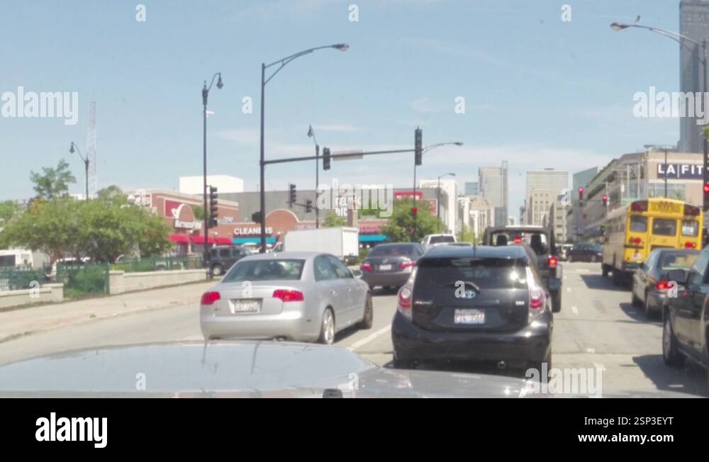 Driving car in traffic on streets of downtown Chicago, Illinois, USA ...
