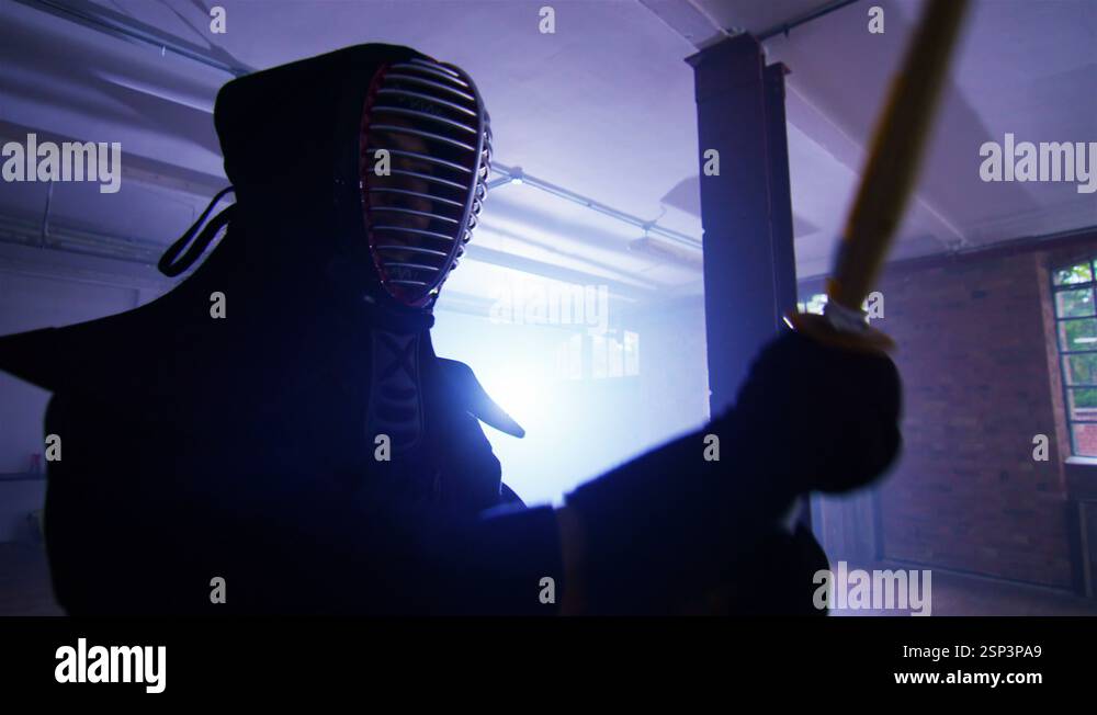 4K Japanese kendo fighters with bamboo swords competing in dark ...