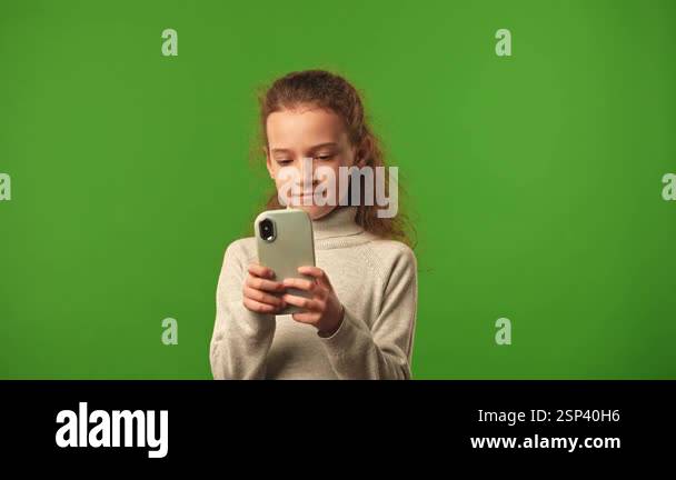 Children emotions concept. Little girl child holding smartphone and ...
