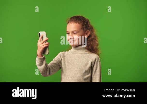 Children emotions concept. Little girl child holding smartphone and ...