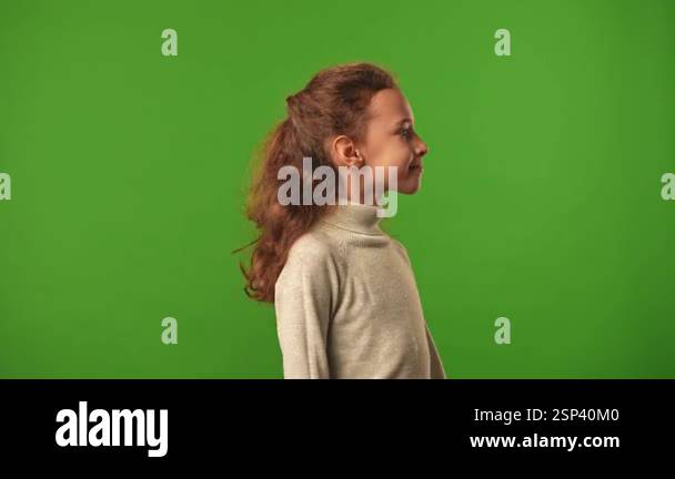 Children emotions concept. Little girl child looks around and waves ...