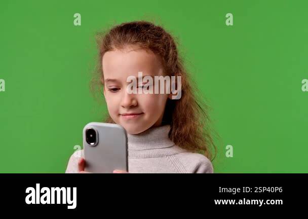Children emotions concept. Little girl child holding smartphone and ...