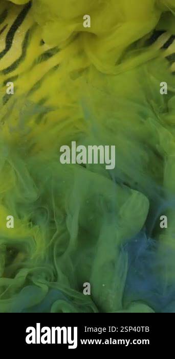 Vertical video. Mist floating. Paint water mix. Defocused green blue ...