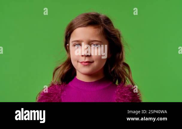 Children emotions concept. Little girl child in shirt standing looking ...