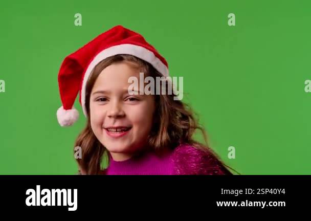 Children emotions concept. Smiling girl child in santa hat dancing ...