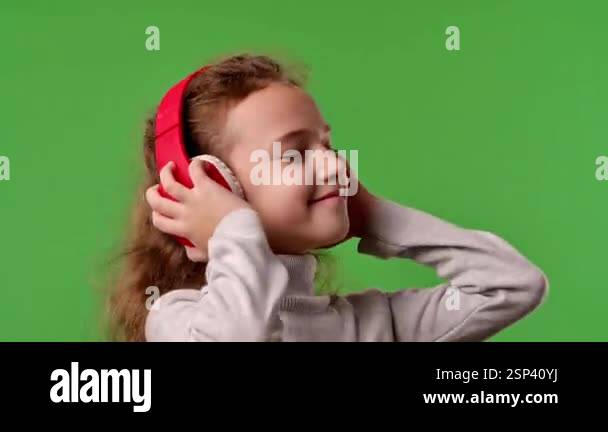 Children emotions concept. Little girl child listening music in ...