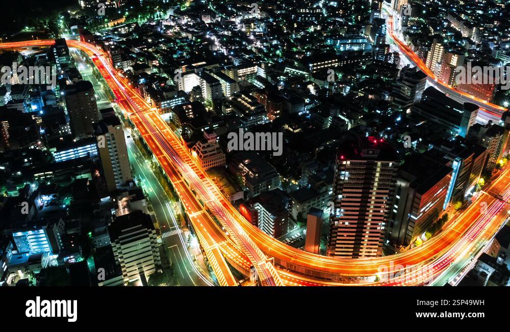 Night becomes day over a massive highway intersection in Tokyo, Japan ...
