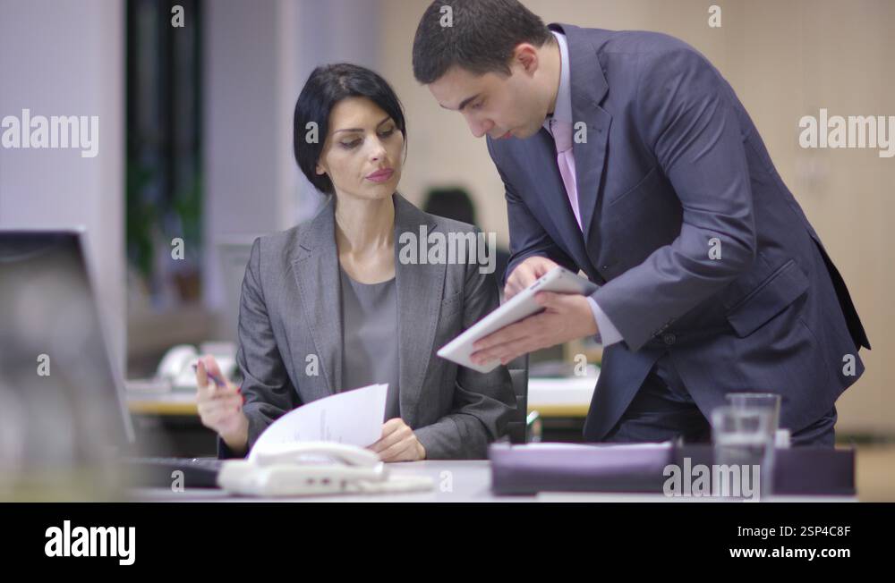 Women Leaders, Young Woman In Business Suit. Sitting in an office at ...
